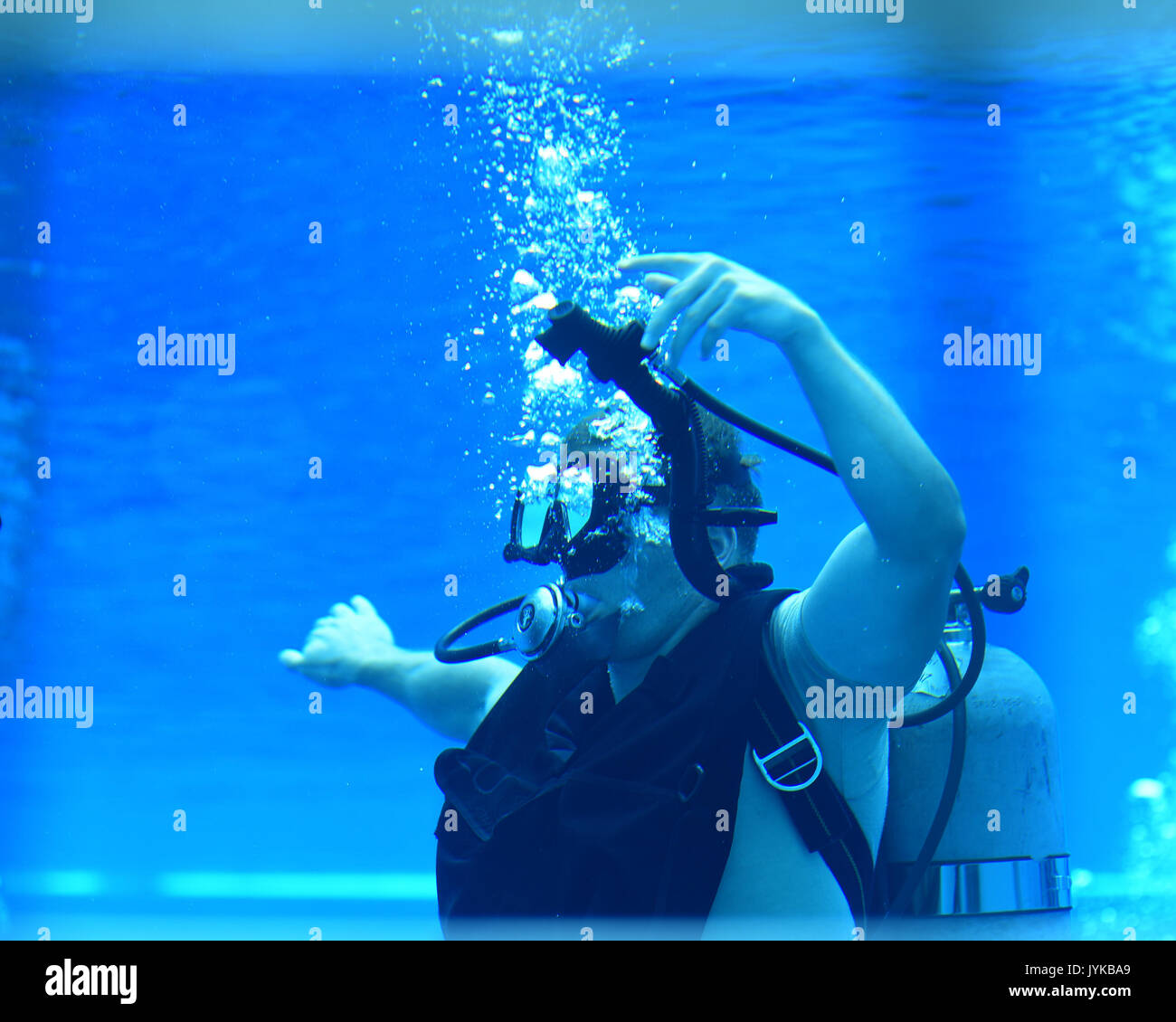 A U.S. Air Force diving student swims to the surface during underwater ...