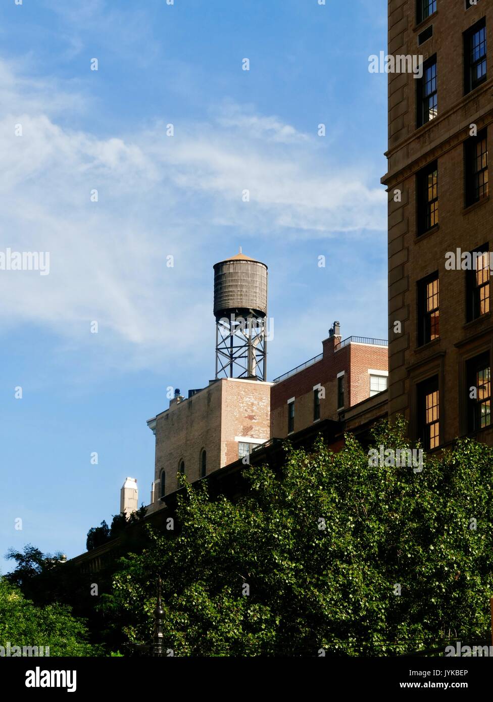 Large water tower on Manhattan rooftops, New York City, NY, USA Stock ...
