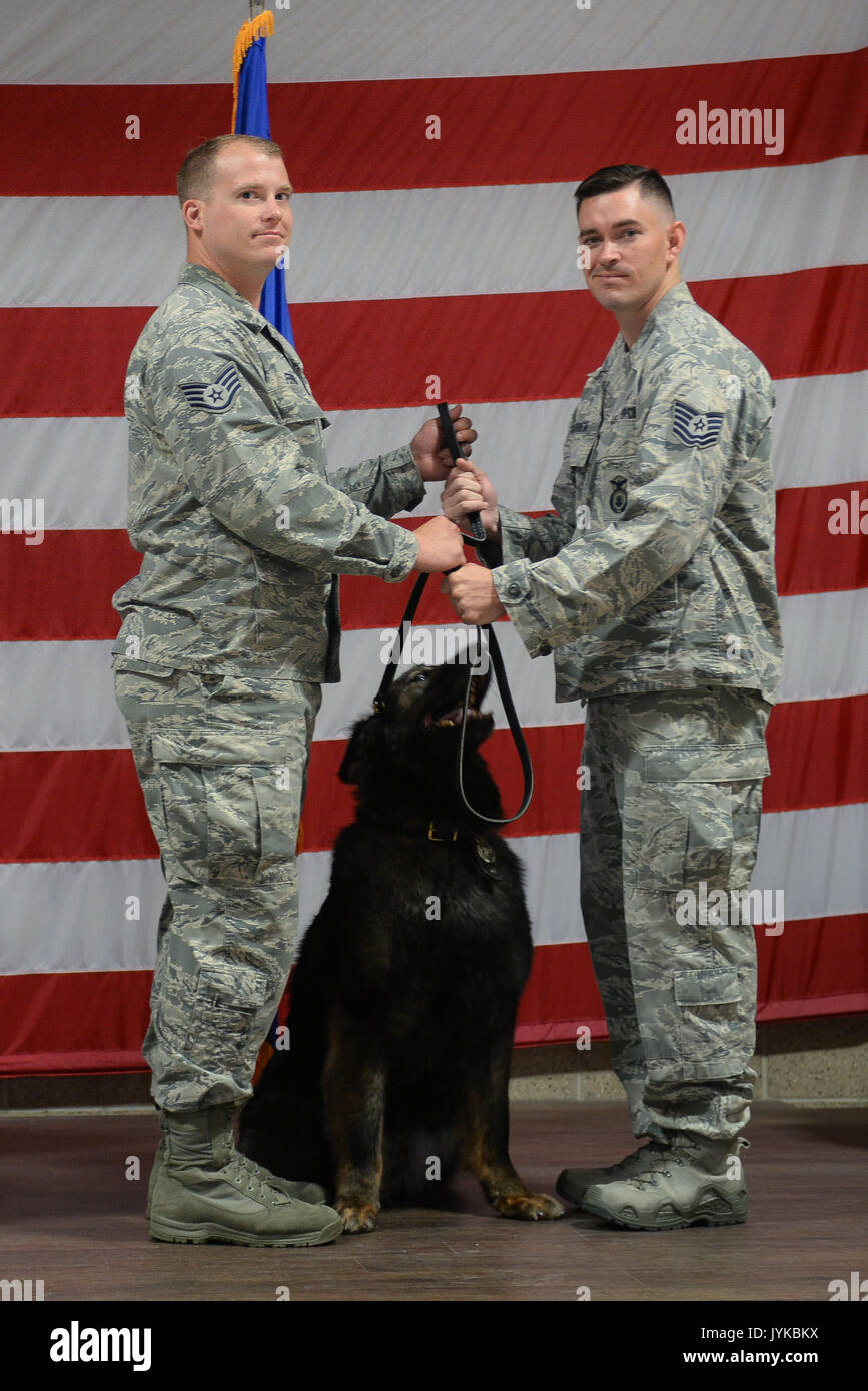 Staff Sgt. David Ferro, 55th Security Forces Squadron, hands over Dasty ...