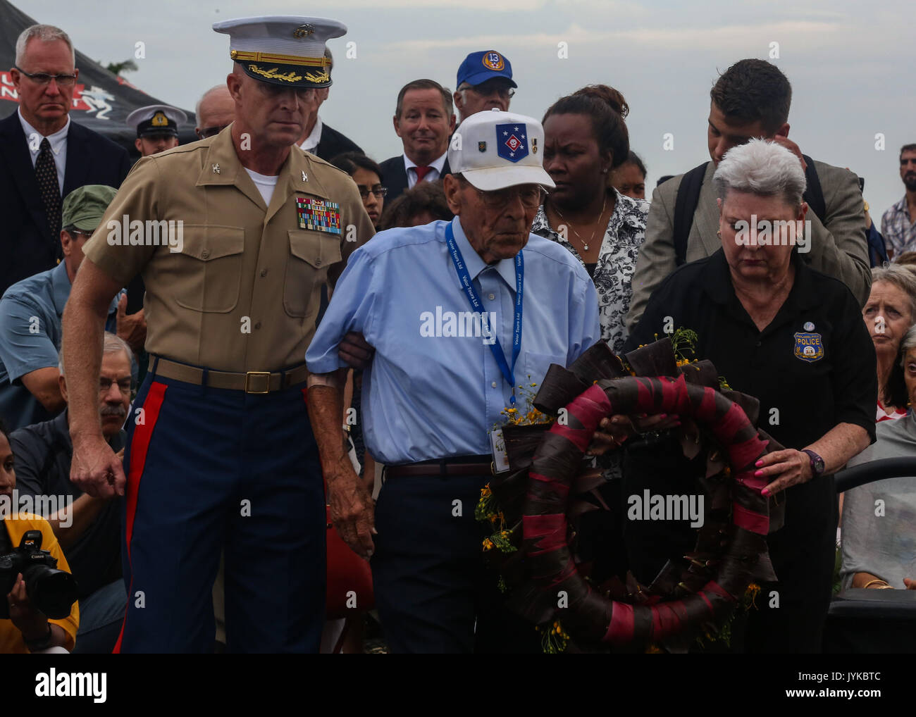 U.S. Marine Corps veteran Harold Berg, who fought in World War II, lays ...