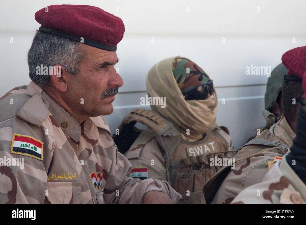 Iraqi security forces members receive instruction from a Spanish army ...