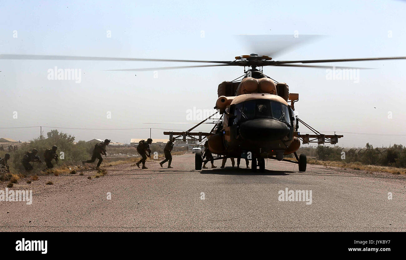 Iraqi army rangers board a MI17 helicopter during the combined arms ...