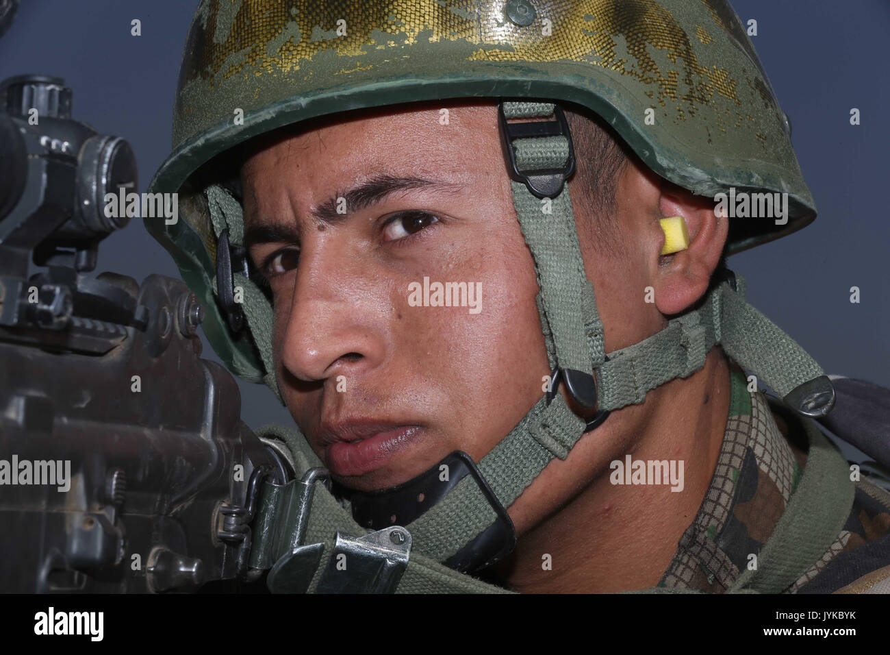 An Iraqi army ranger aims down the sights of his weapon system during ...
