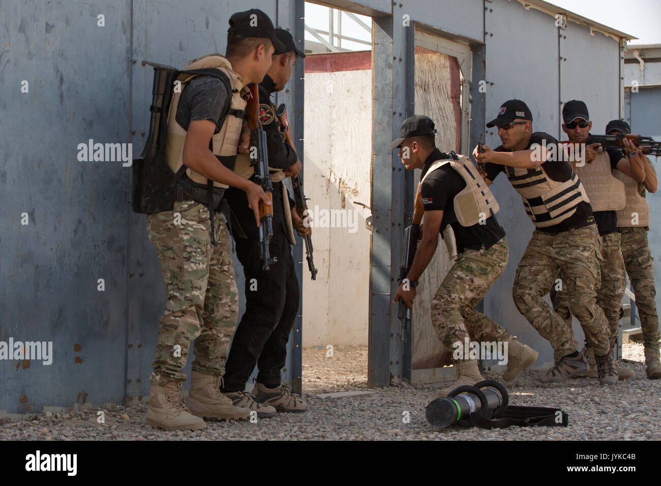 Iraqi security forces members clear a room during urban warfare ...