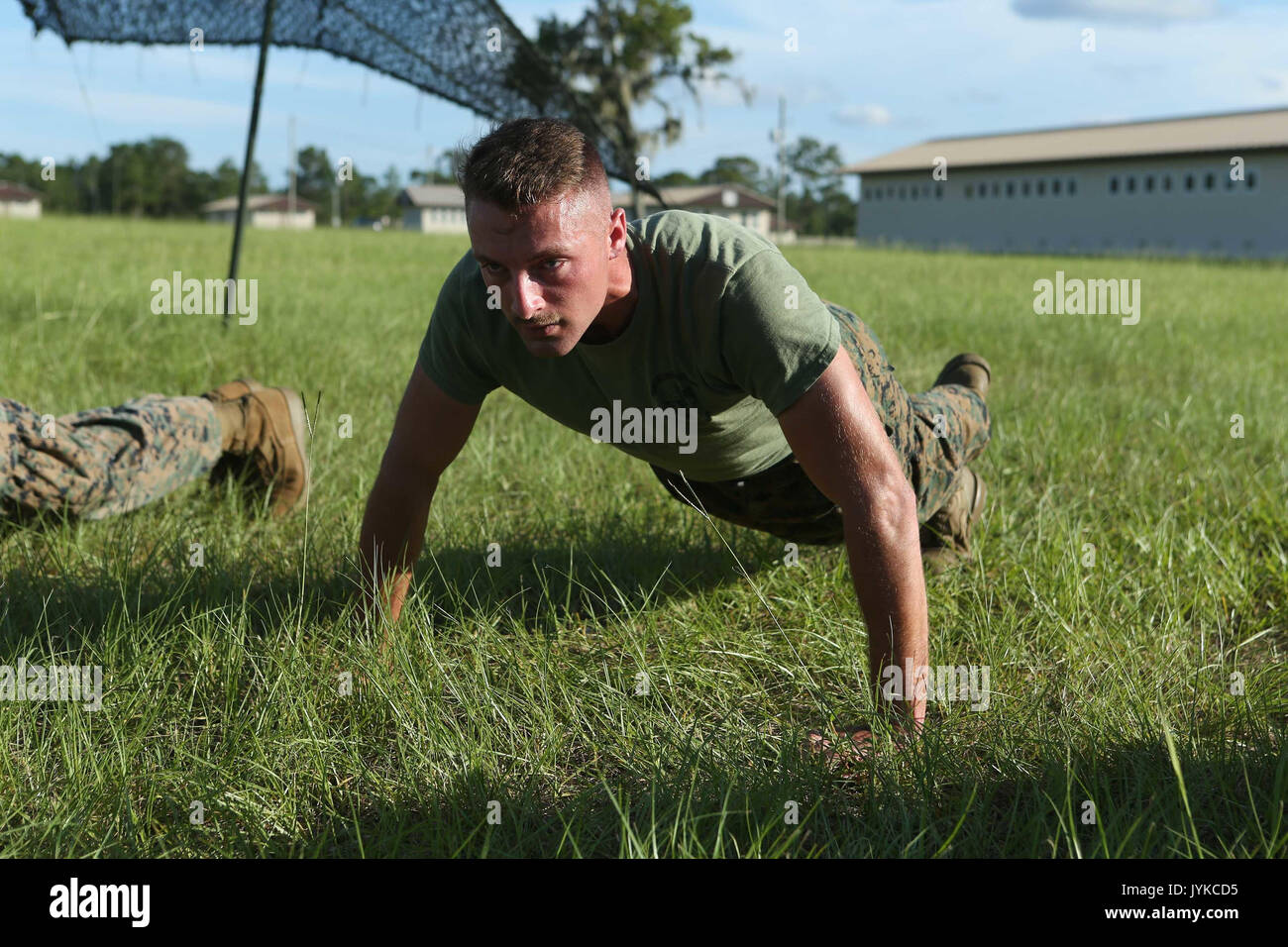 U.S. Marine with 2nd Marine Logistics Group, does pushups during Marine ...