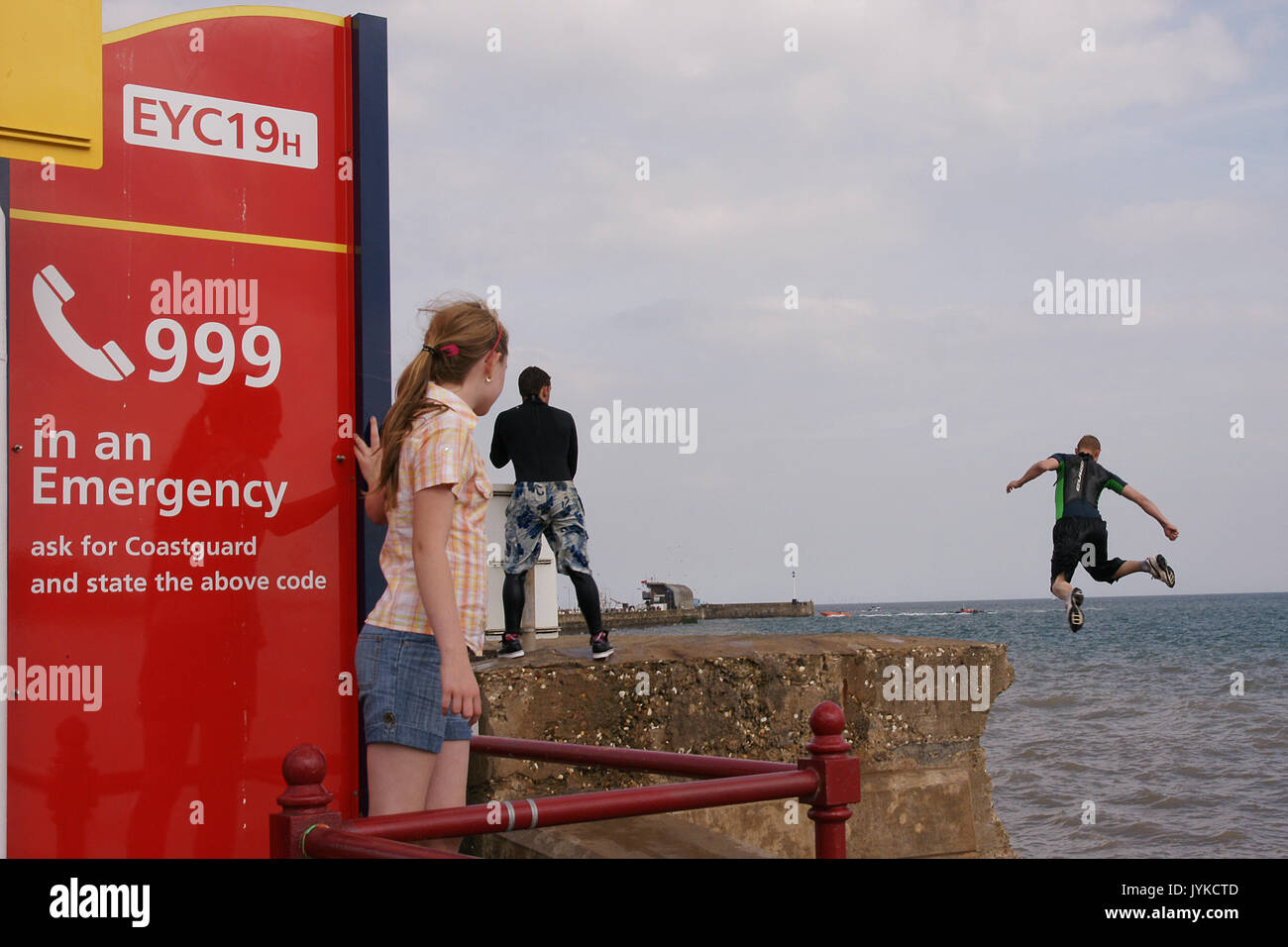 Jumping off harbour wall hi-res stock photography and images - Alamy