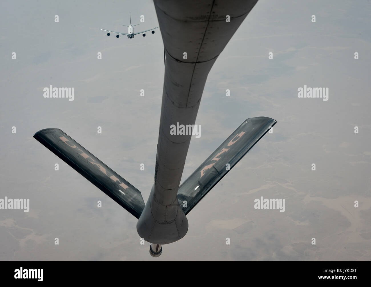 A RC-135V/W Rivet Joint approaches a KC-135 Stratotanker assigned to ...