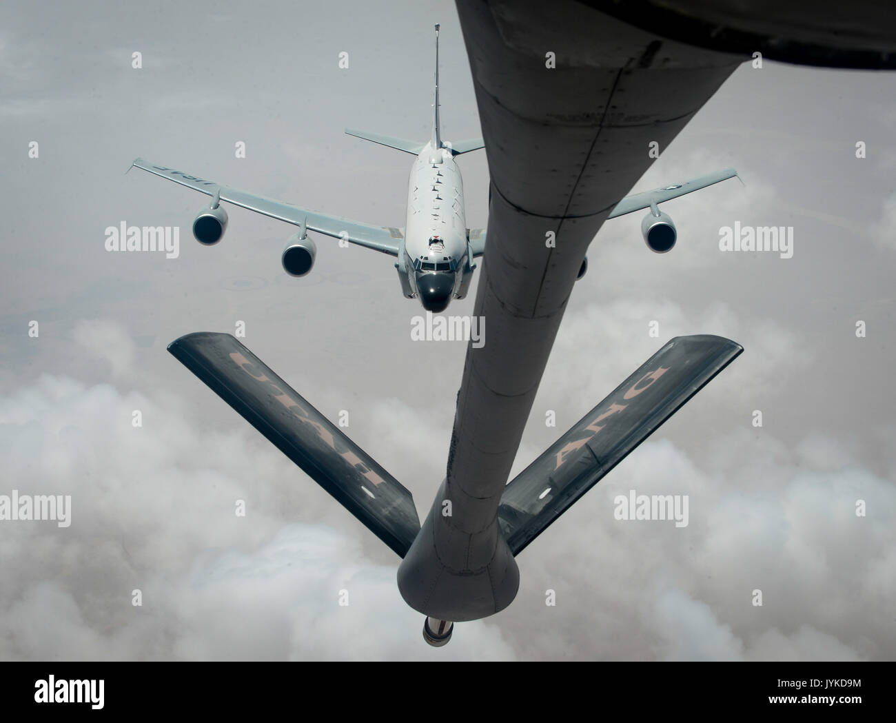 A RC-135V/W Rivet Joint prepares to receive fuel from a KC-135 ...