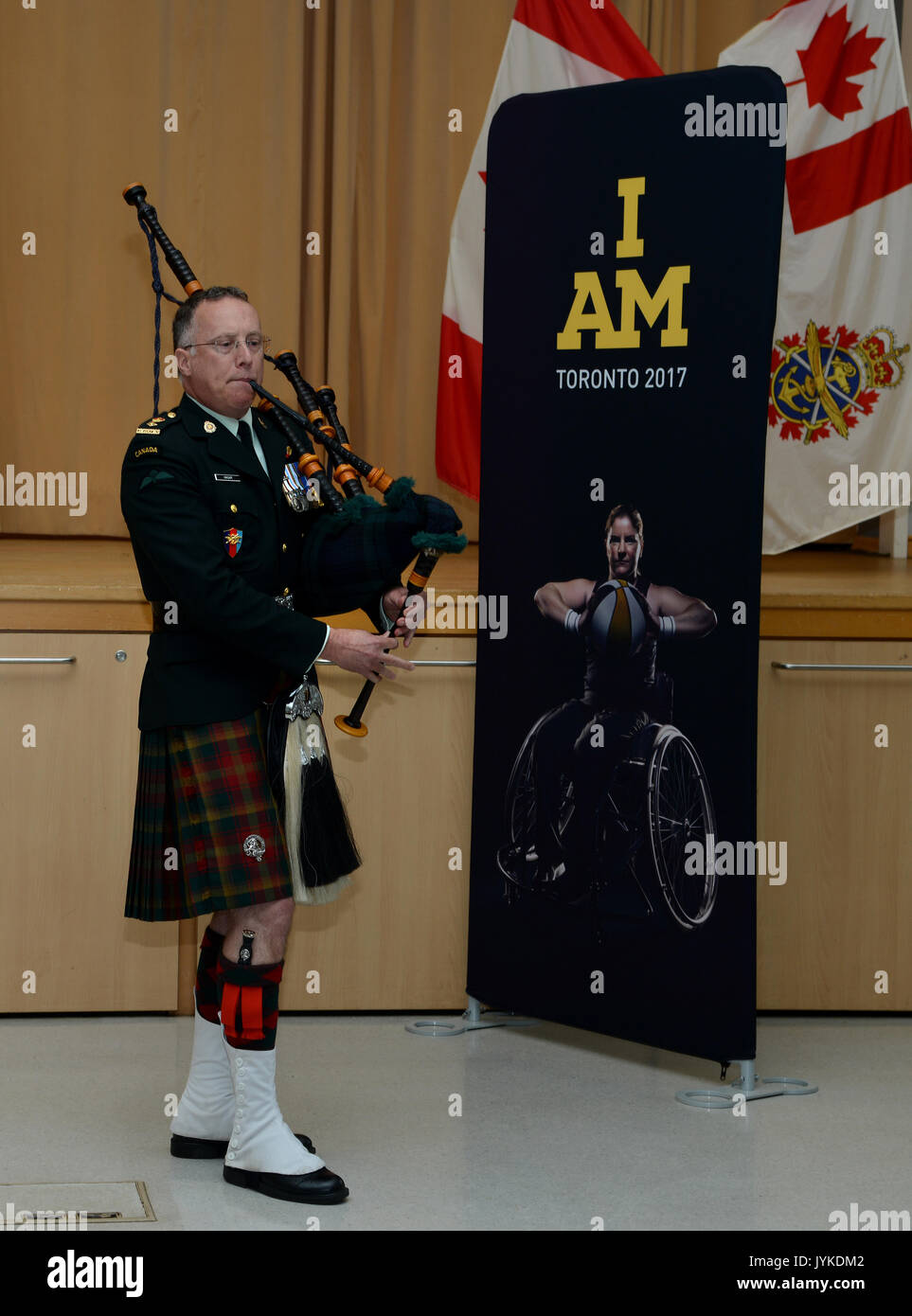 Canadian Lt. Col. Gordon Hagar provided bagpipe music for guests ...
