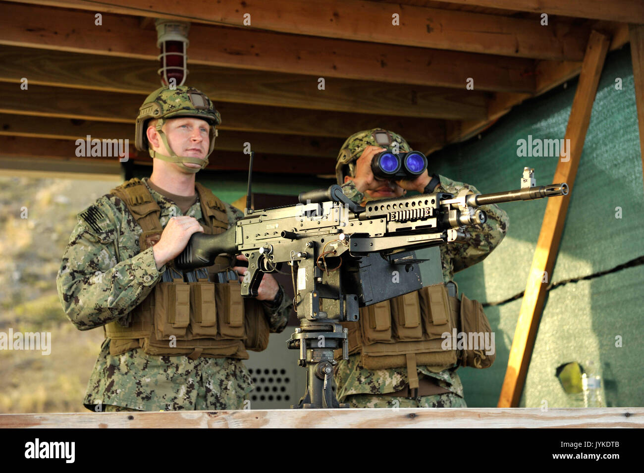 Coast Guard service members with Port Security Unit 305 scan the ...
