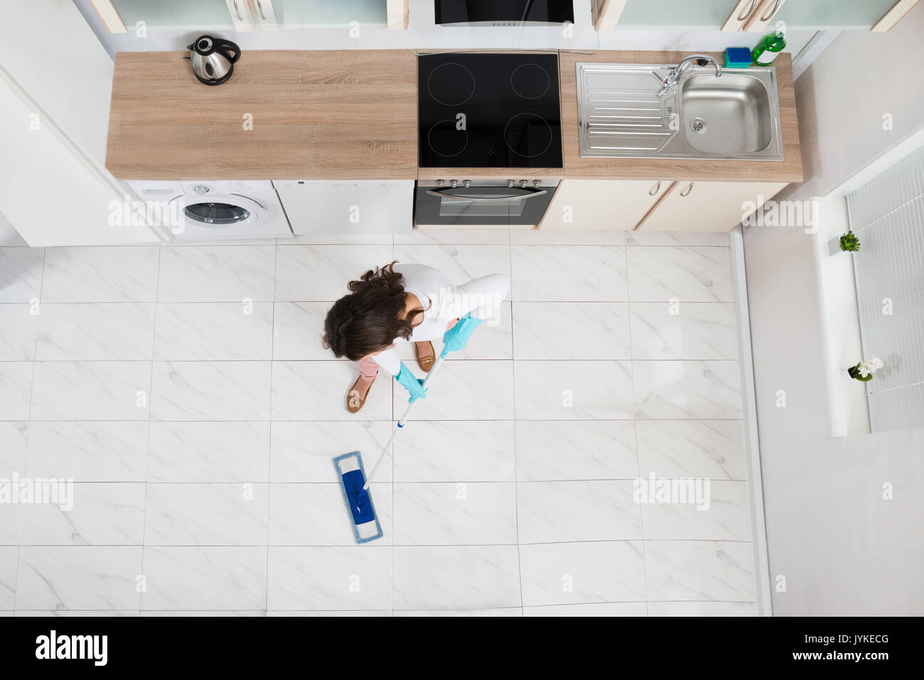 Woman mopping floor hi-res stock photography and images - Alamy