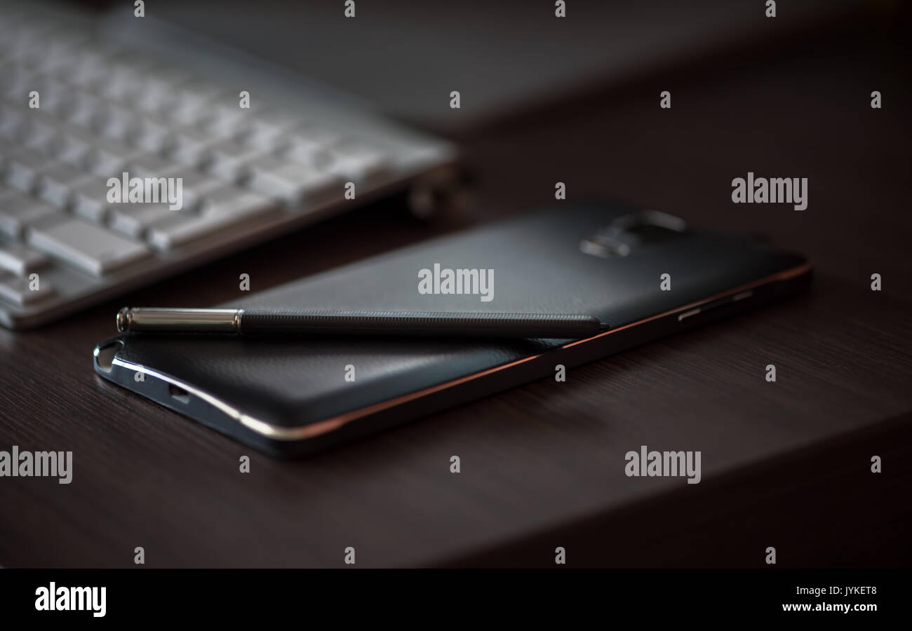 Smart phone and laptop - business concept Stock Photo - Alamy