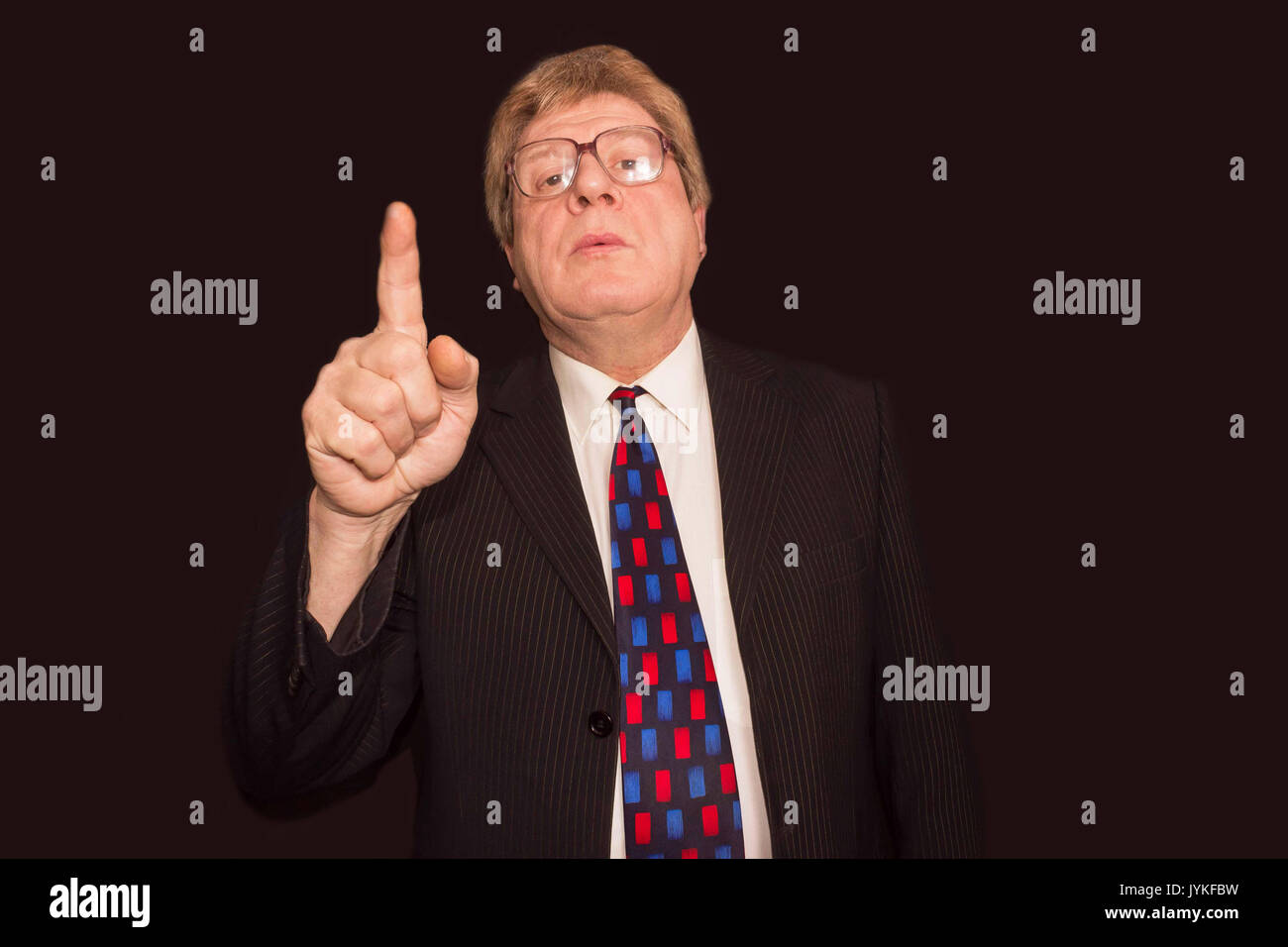 The Senior Business Man Raising Finger Up Stock Photo - Alamy