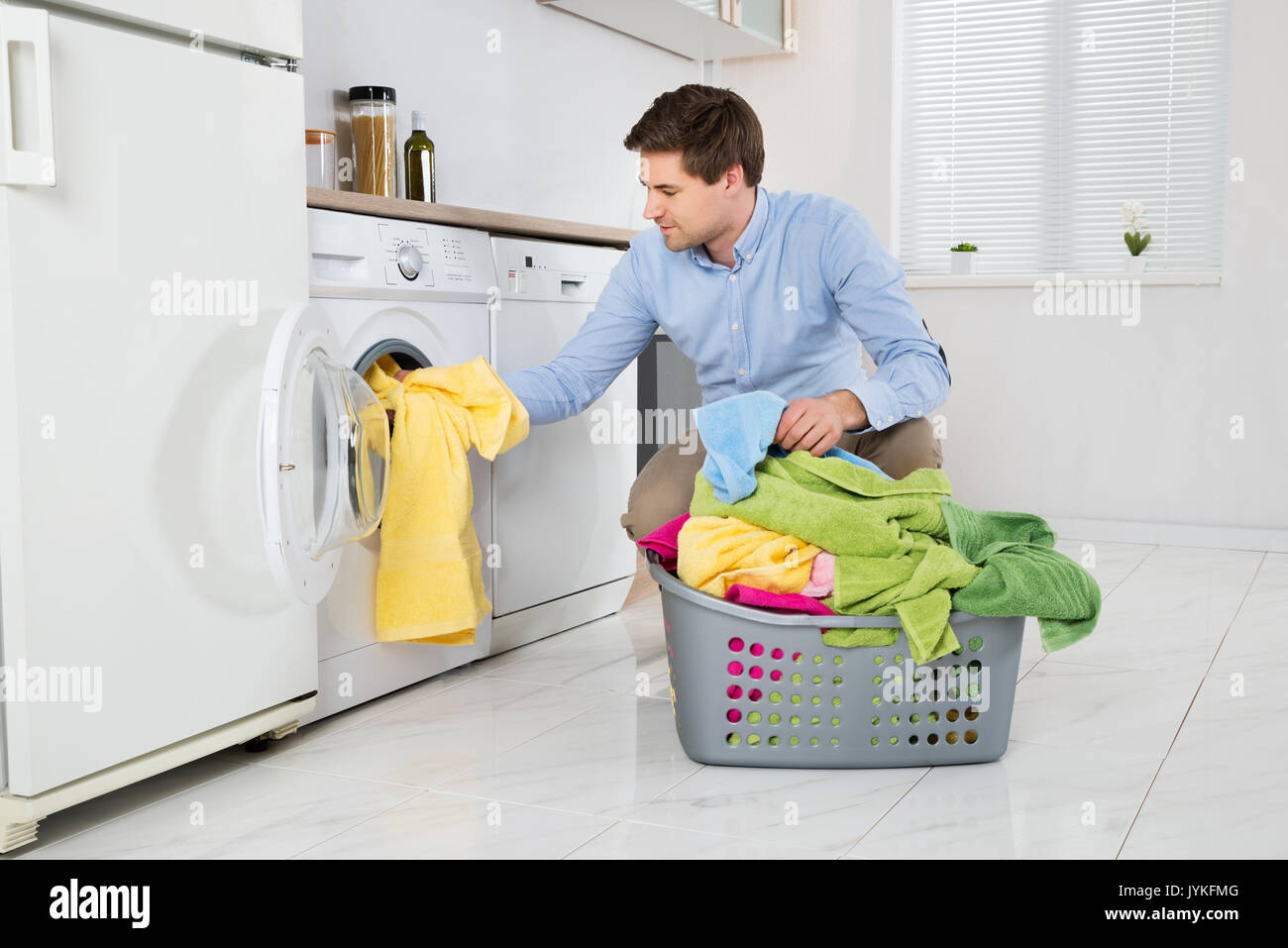 Man washing clothes hi-res stock photography and images - Alamy