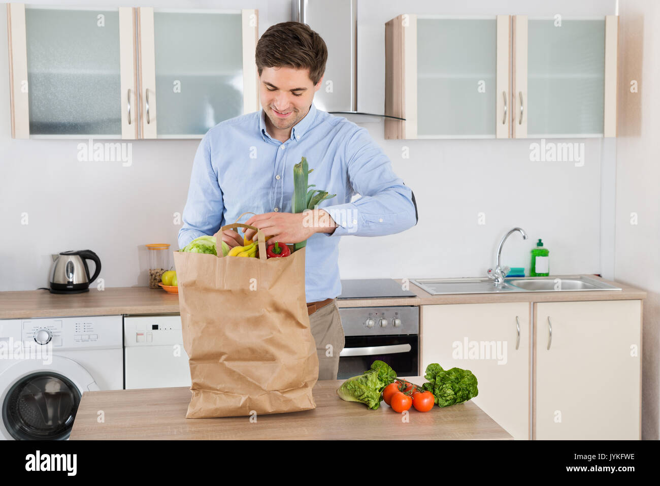 Man with grocery bag hi-res stock photography and images - Alamy