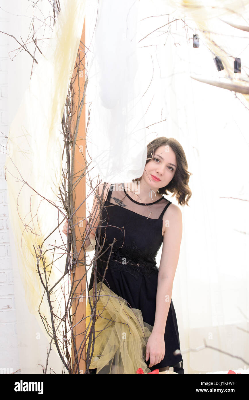 pretty girl at a photo shoot in the studio Stock Photo - Alamy