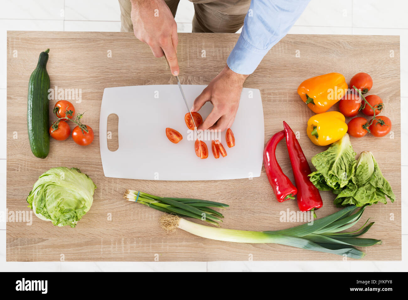 Hands Chopping Vegetables