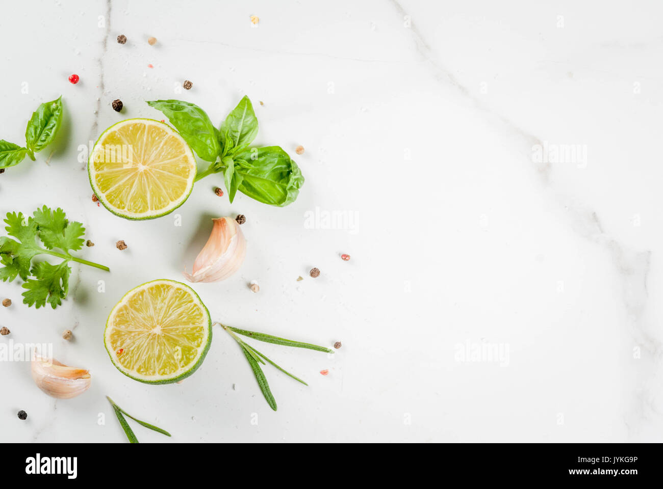 Food cooking background, white marble kitchen table. Spices and herbs ...
