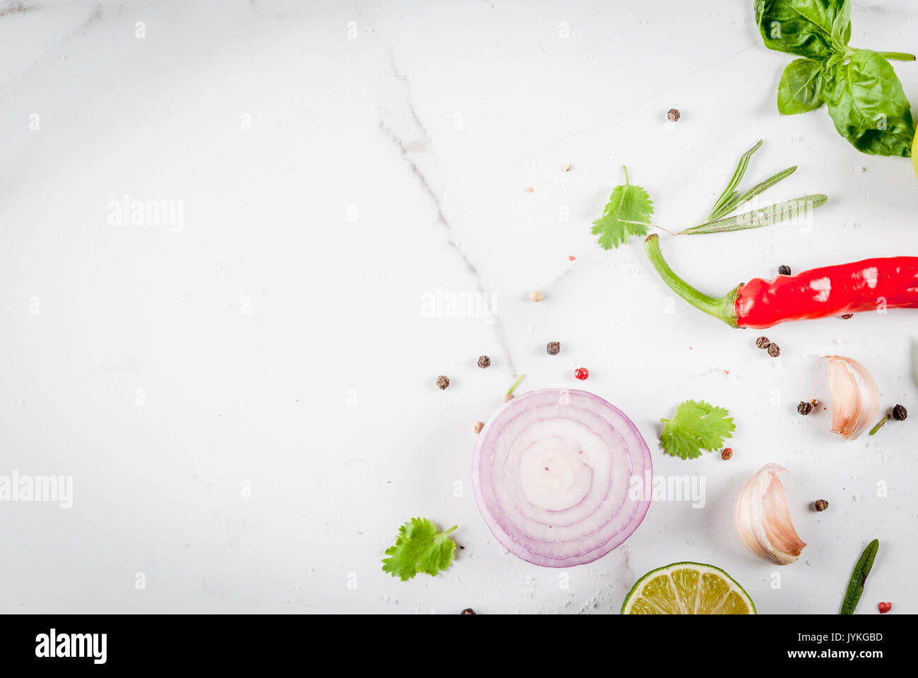 Food cooking background, white marble table. Spices, herbs for dinner ...