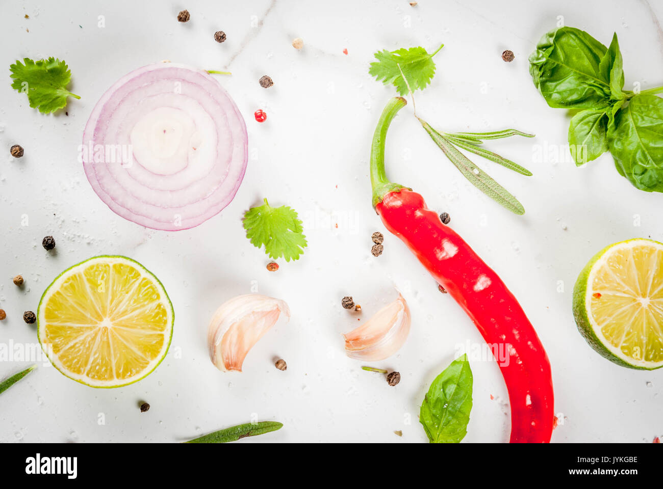 Food cooking background, white marble table. Spices, herbs for dinner ...