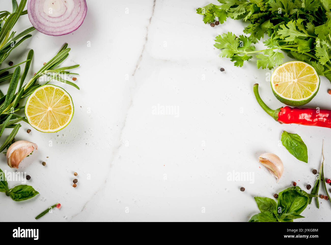 Food cooking background, white marble table. Spices, herbs for dinner ...