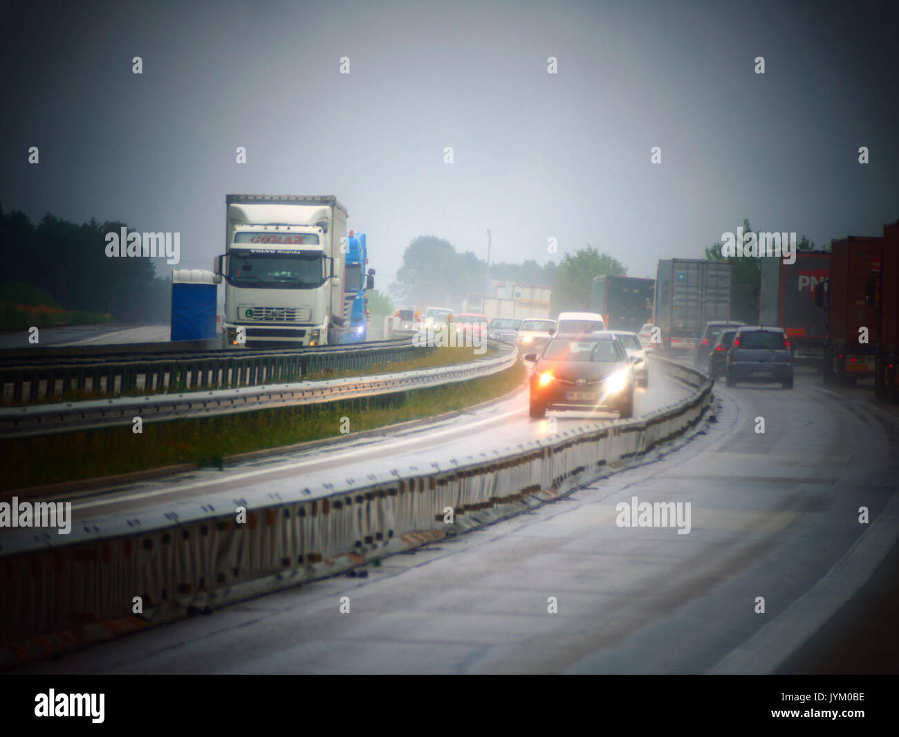 Germany German Autobahn Motorway Expressway Highway traffic rainy day ...