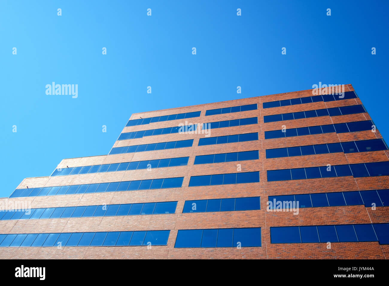 View up generic corporate office building in the sun Stock Photo - Alamy