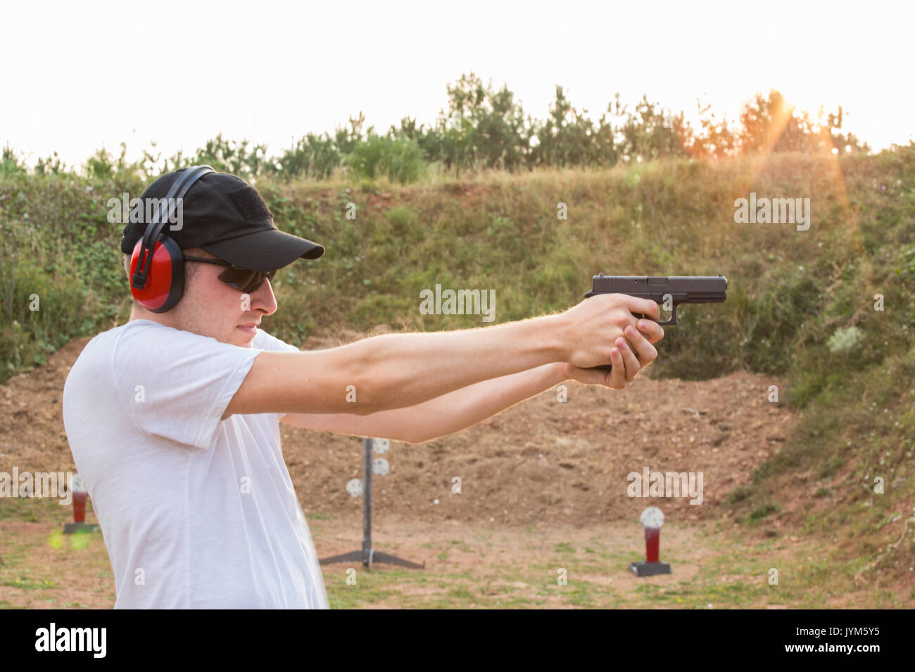 Young policeman or special secret service agent wants to kill the enemy ...