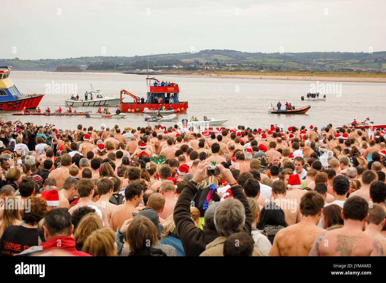 Crowds gather on Exmouth beach for the start of the traditional swim on ...