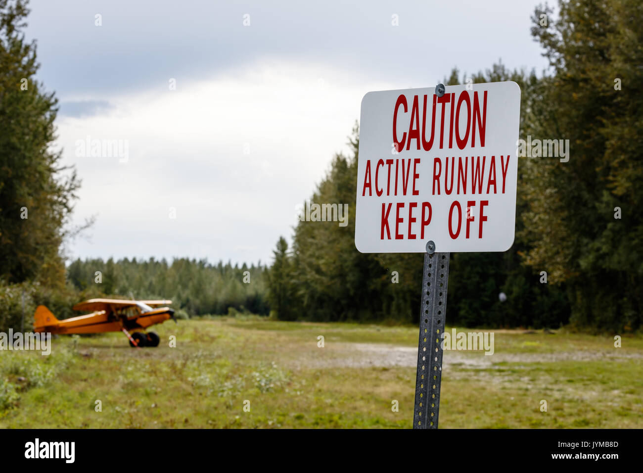 Warning sign for small bush planes runway Stock Photo - Alamy