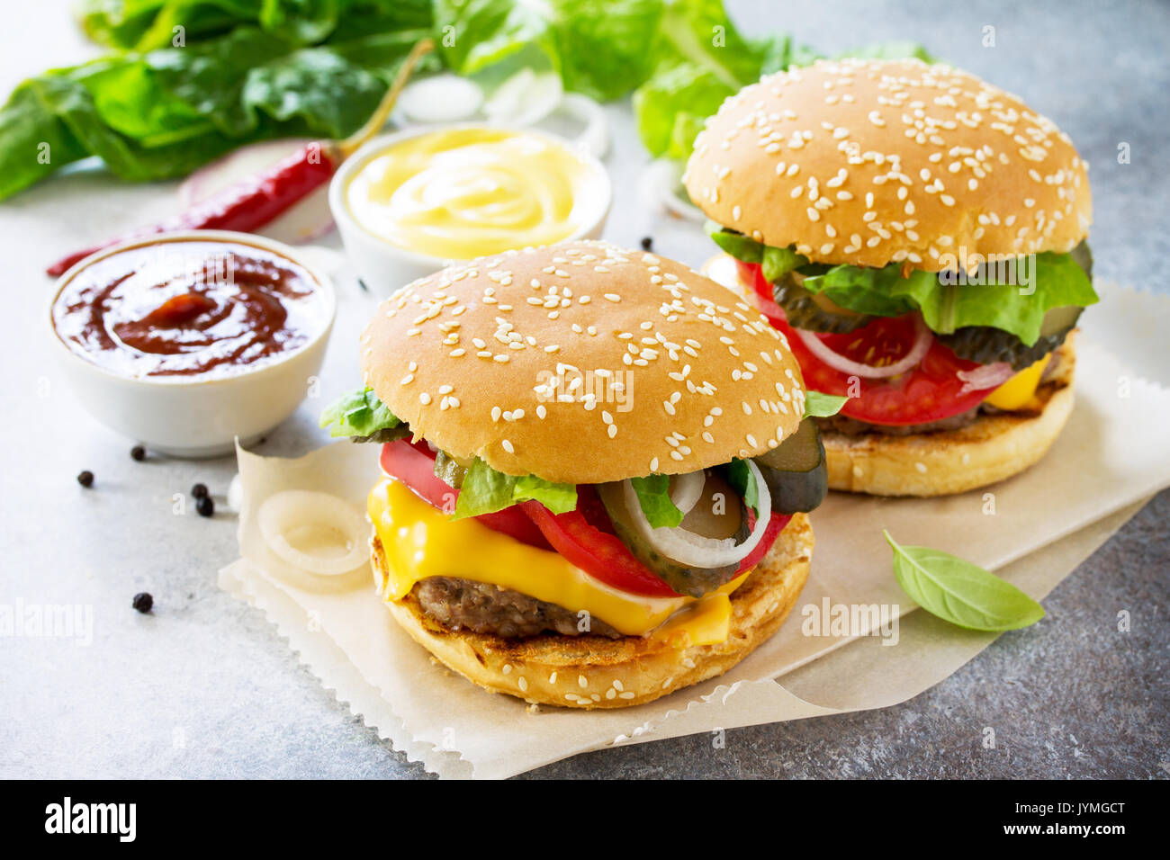A delicious fresh homemade hamburger on a slate or stone table Stock ...