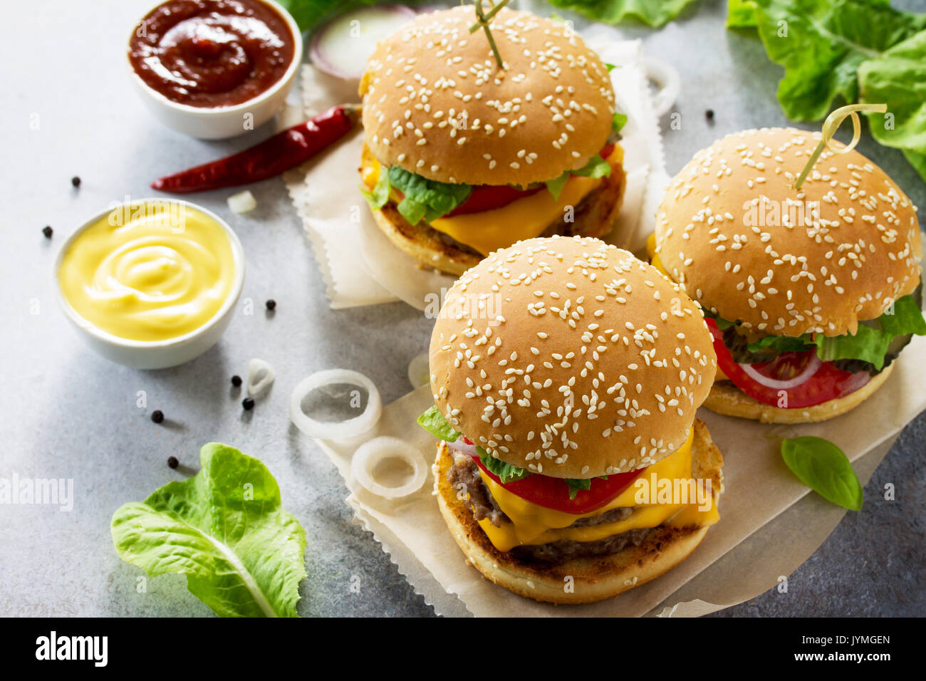 A delicious fresh homemade hamburger on a slate or stone table Stock ...