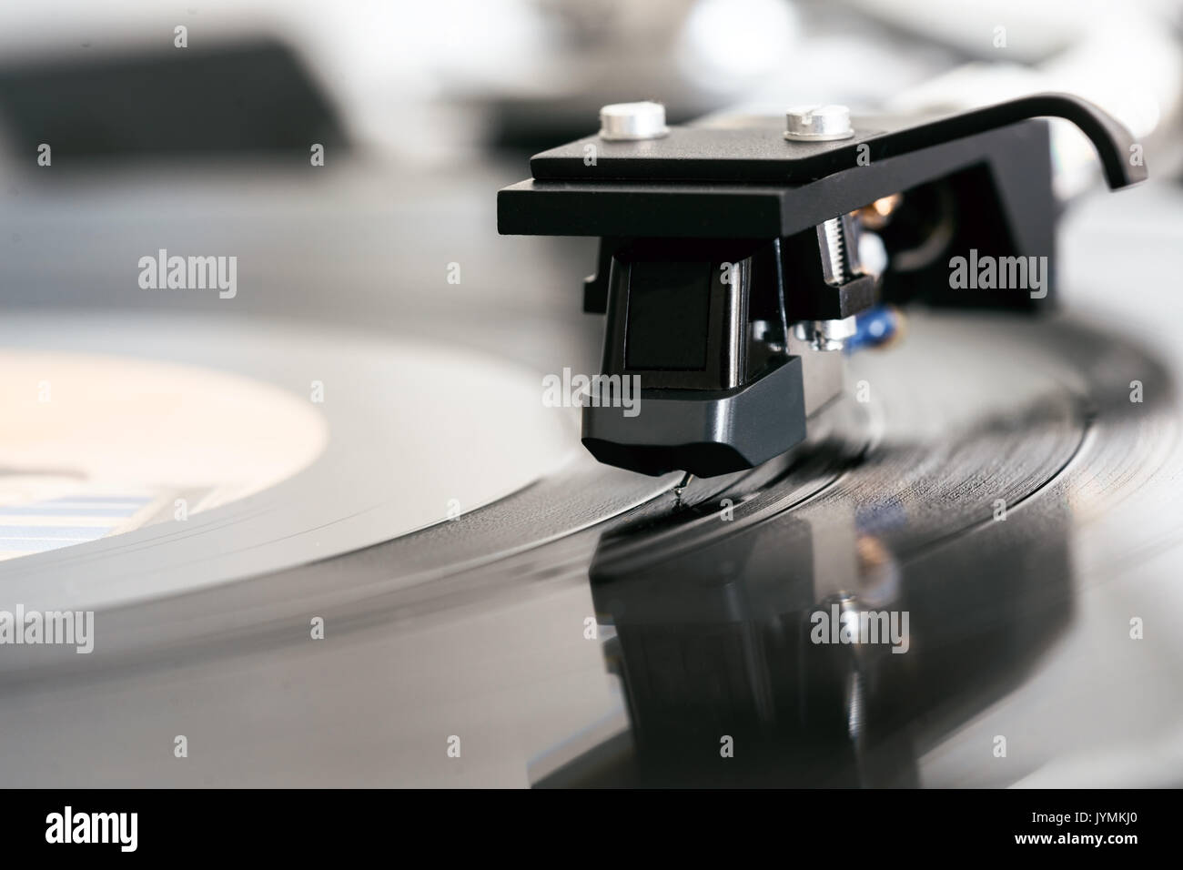 vinyl Turntable with black hi-fi headshell cartridge in action closeup ...