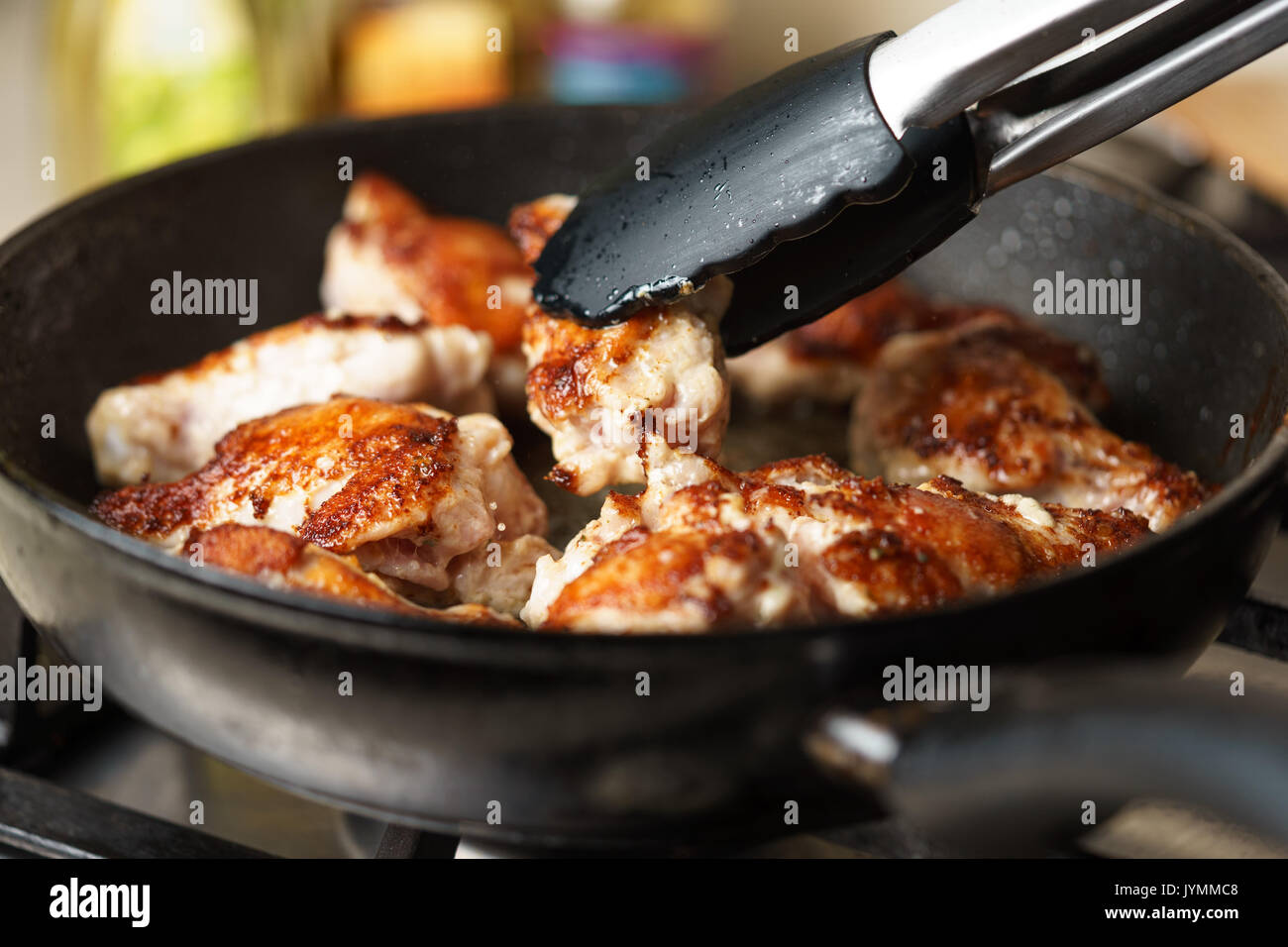 Cooking chicken in kitchen hi-res stock photography and images - Alamy