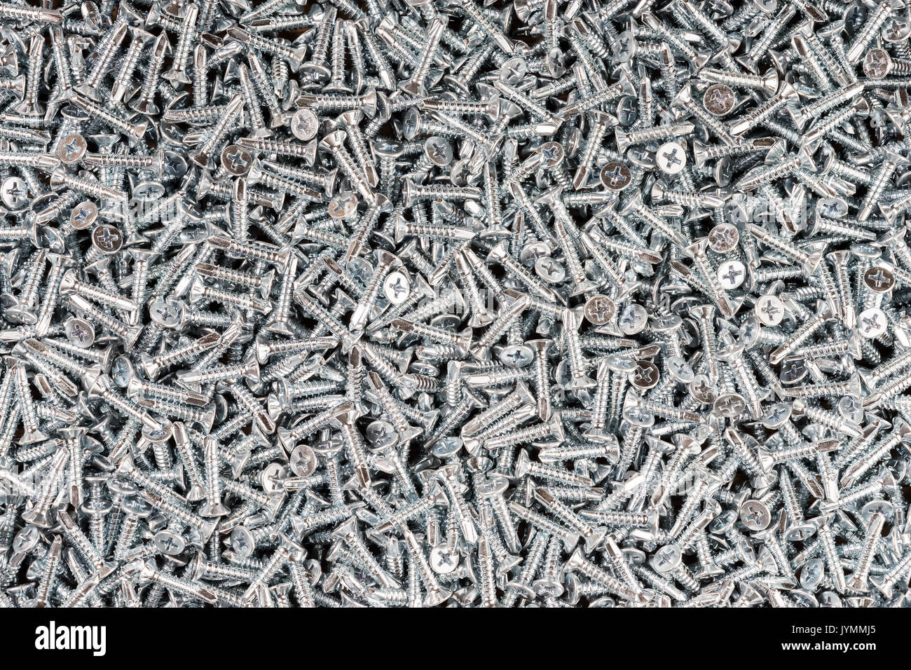 pile of Silver Screws Macro Closeup Background Stock Photo - Alamy