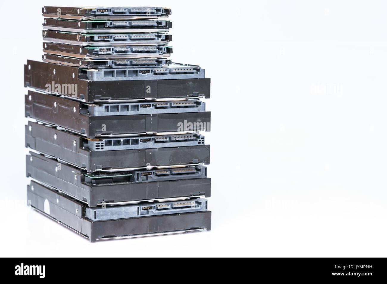 pile of old hard drives at white background Stock Photo - Alamy