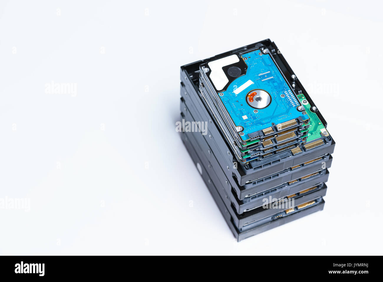 pile of old hard drives at white background Stock Photo - Alamy