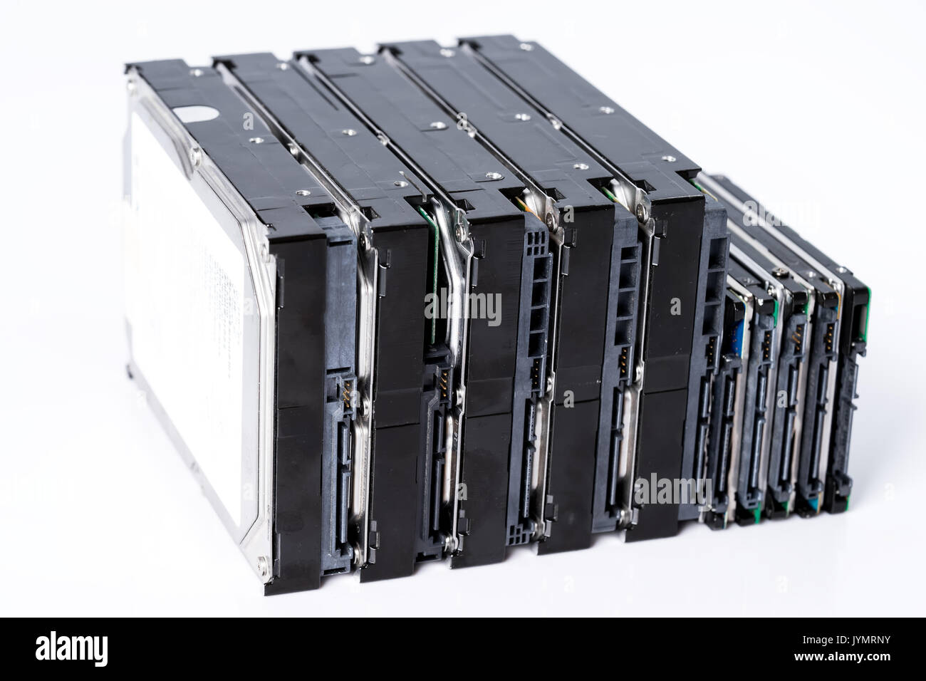 pile of old hard drives at white background Stock Photo - Alamy
