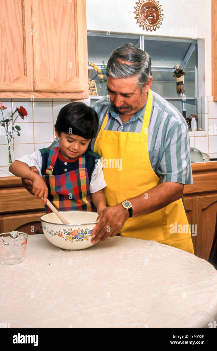 granddad mixing batter teaching cute small little boy role model ...