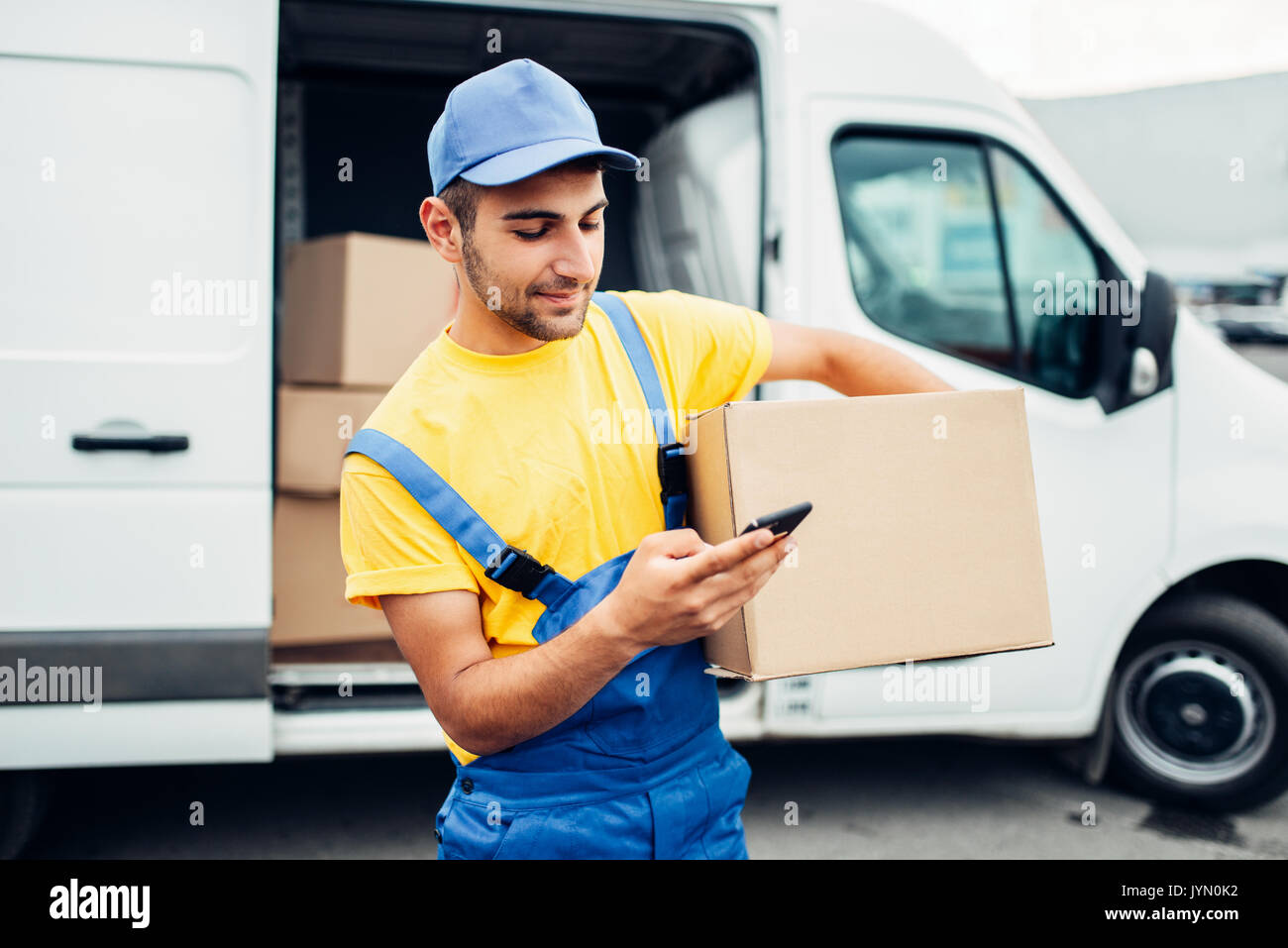 Cargo distribution industry, delivery service. Worker in uniform with ...