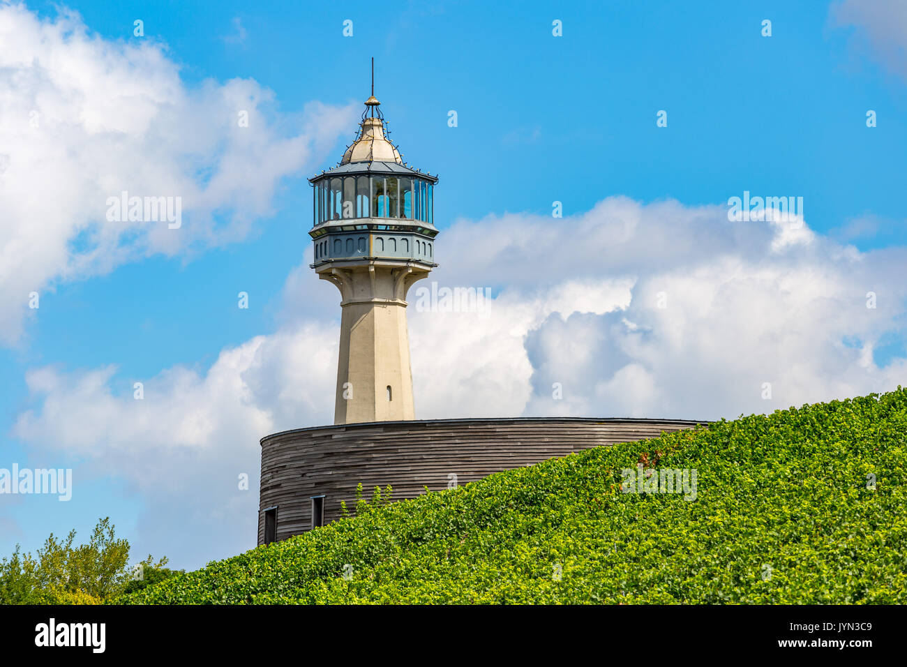 Le Phare lighthouse amid green vineyards in small village of Verzenay ...