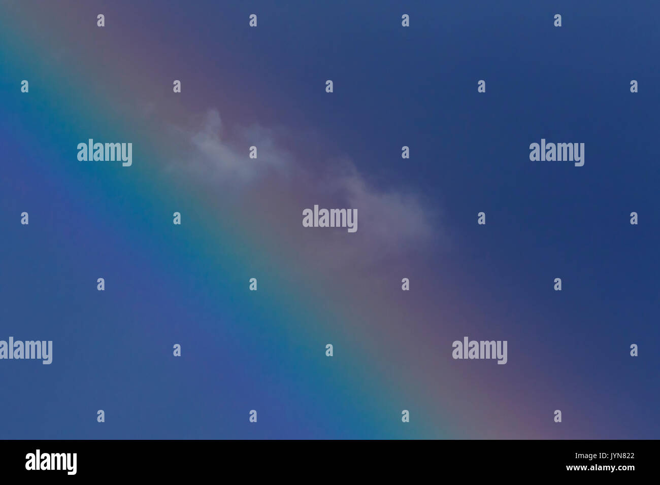 Rainbow "close up" with cloud Stock Photo - Alamy