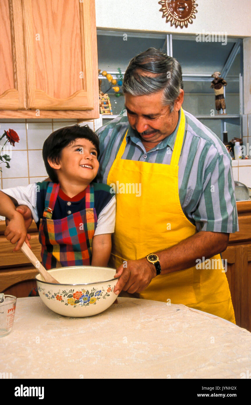 granddad mixing batter teaching cute small little boy role model ...