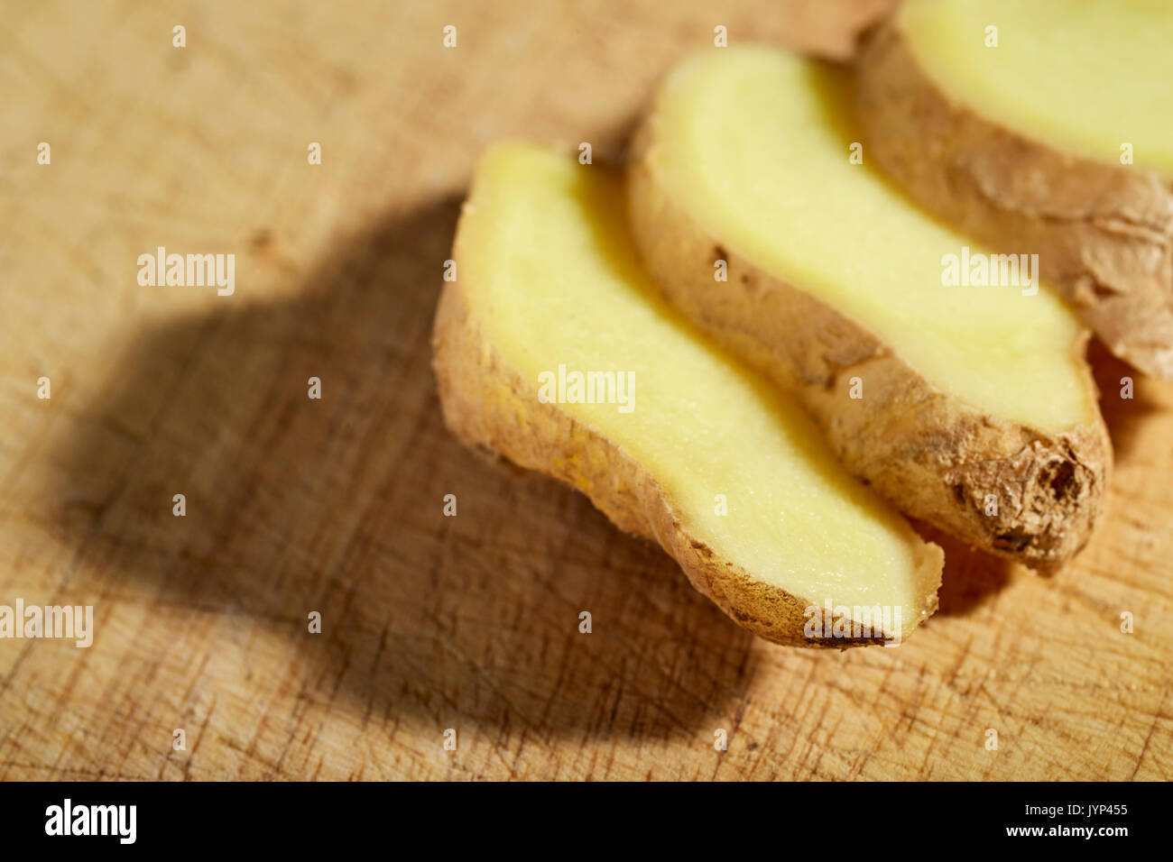 slices of fresh, raw ginger root Stock Photo - Alamy