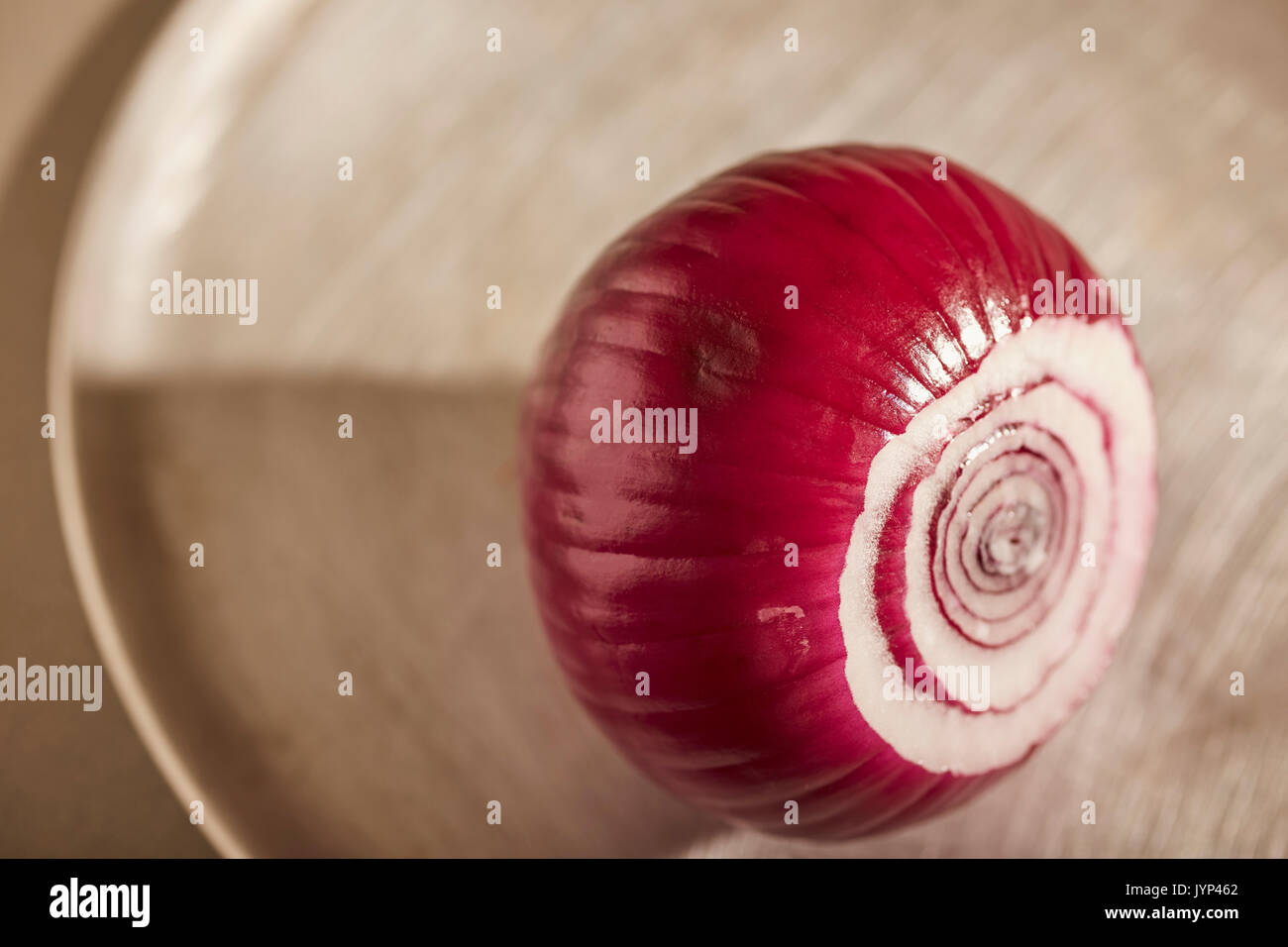 a peeled red onion on a gray metal background Stock Photo - Alamy