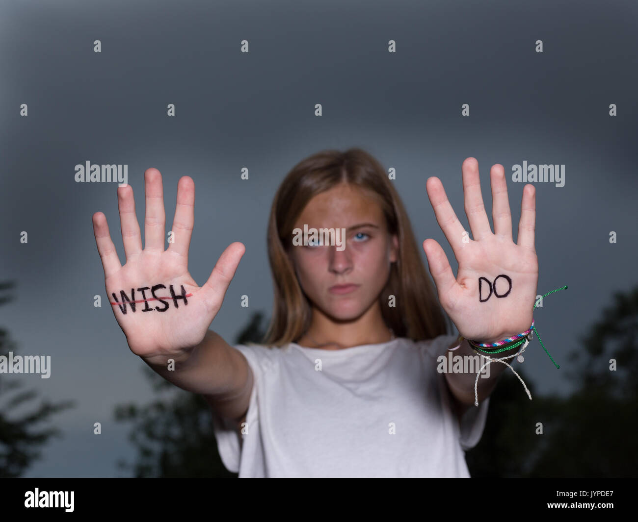 Teenage Girl hold up hands with motivational quotes written on palms ...
