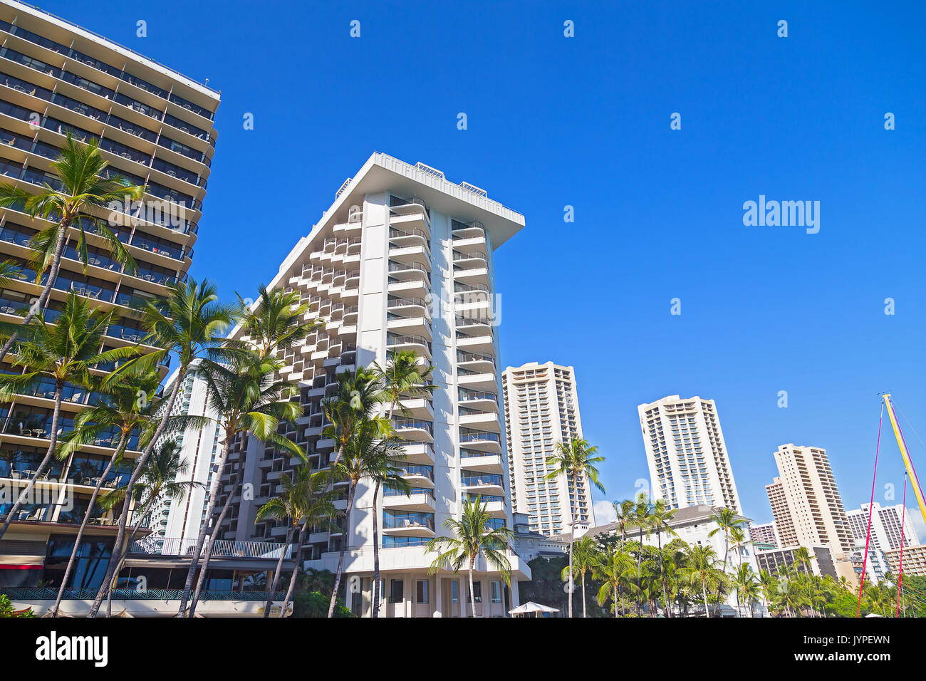 Tall buildings trees under clear hi-res stock photography and images ...