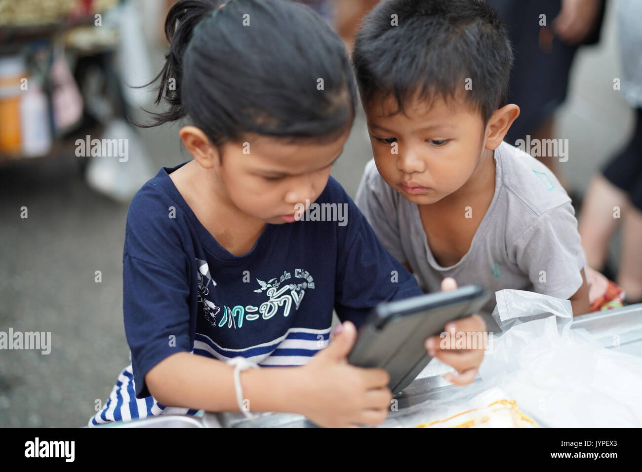 Asian kids with ipad hi-res stock photography and images - Alamy