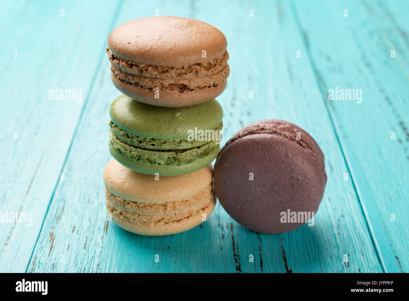 studio shoot of colorful macaroons stack up on a blue background Stock ...