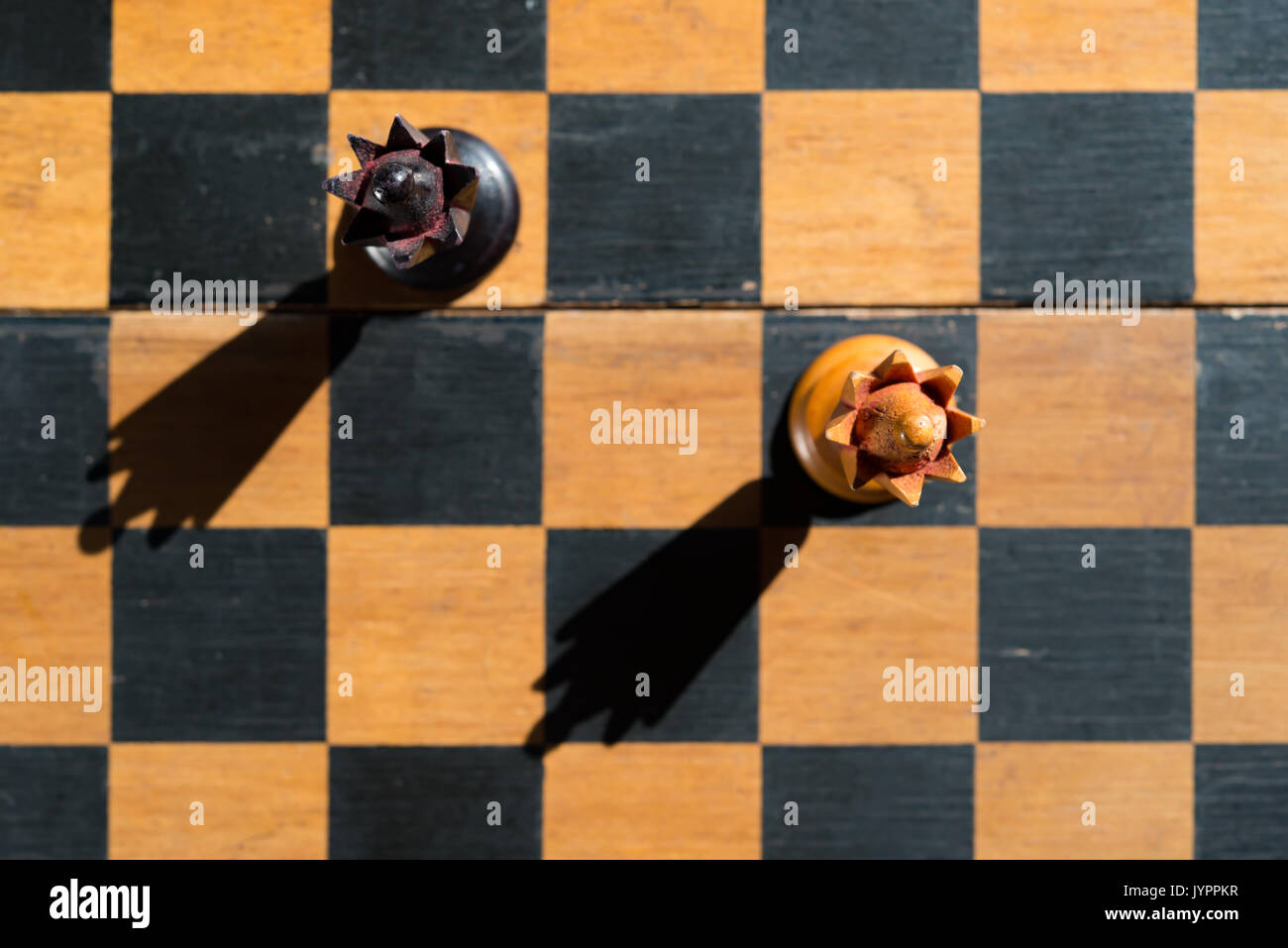 top view Chess Queens stand on chessboard with shadows Stock Photo - Alamy